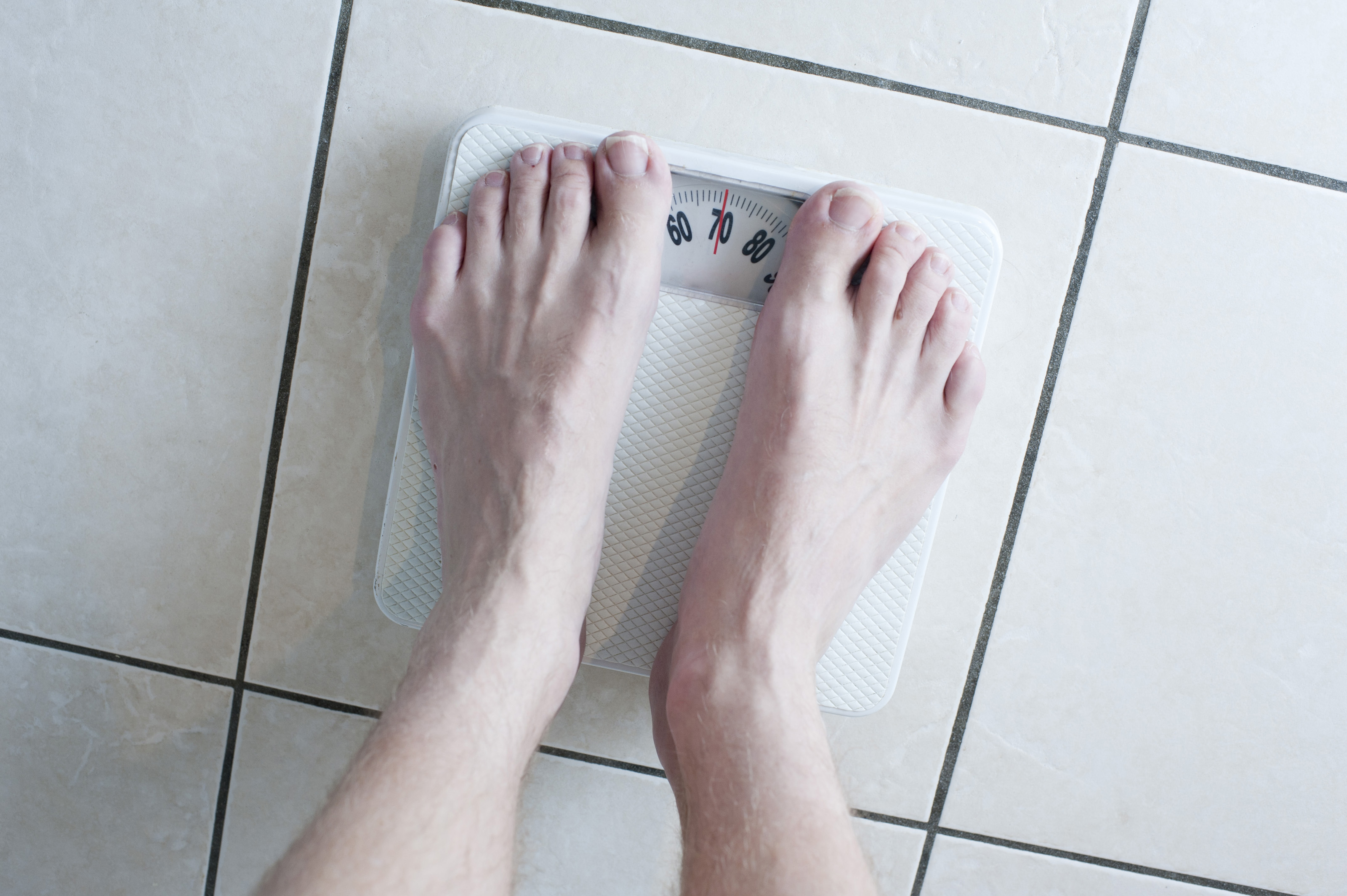 Free Stock Photo 6897 Man Weighing Himself On A Scale Freeimageslive Free Stock Photo 6897 Man Weighing Himself On A Scale Freeimageslive
